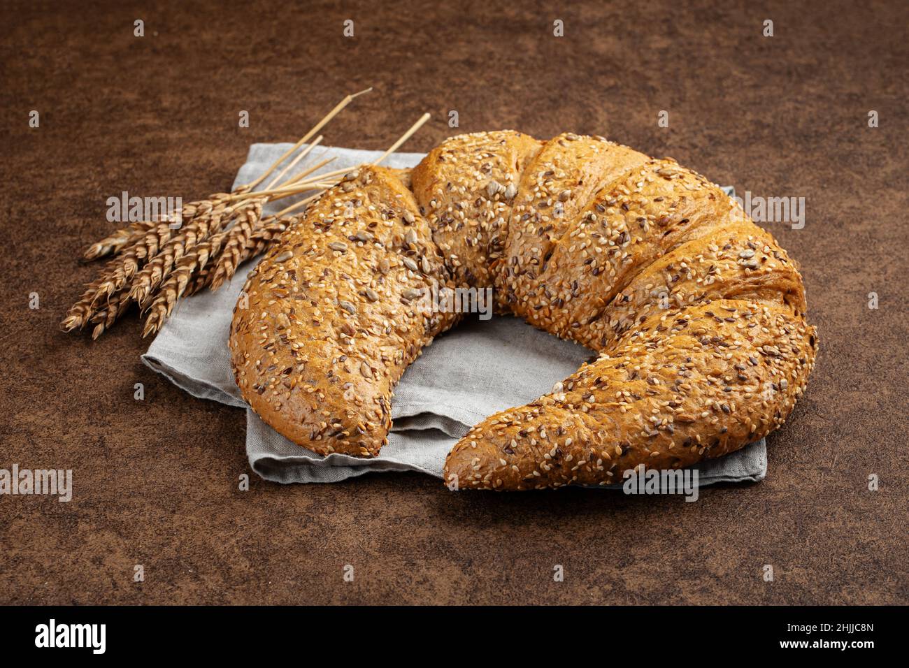 Fresh baked croissant with sesame seeds Stock Photo - Alamy
