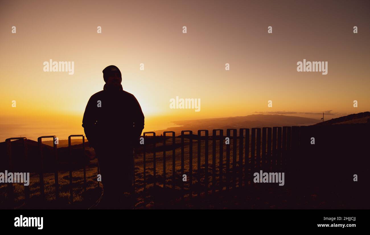 Person standing, watching sunset, silhouette of happy moment Stock ...