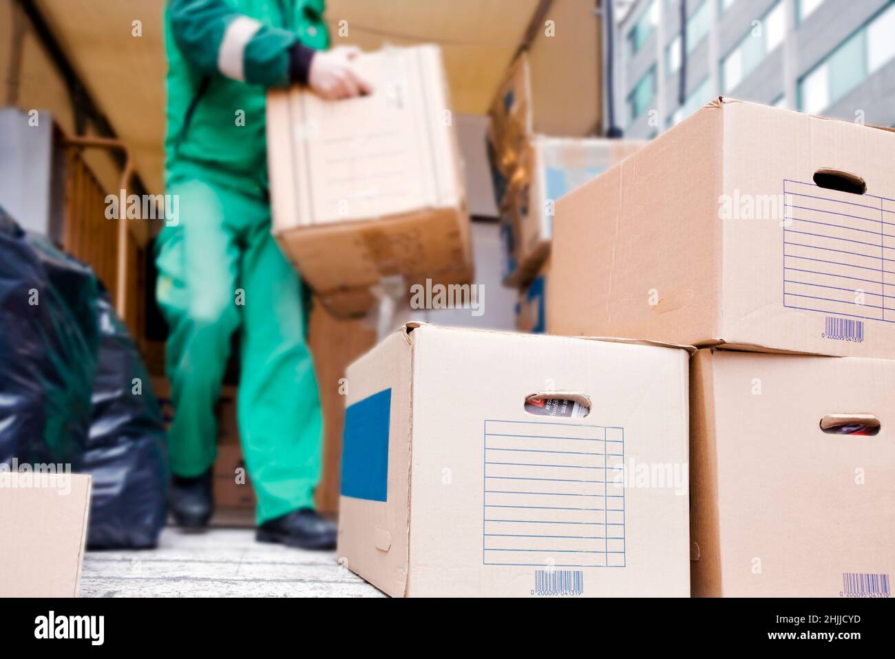 Lifting carrying boxes hi-res stock photography and images - Alamy
