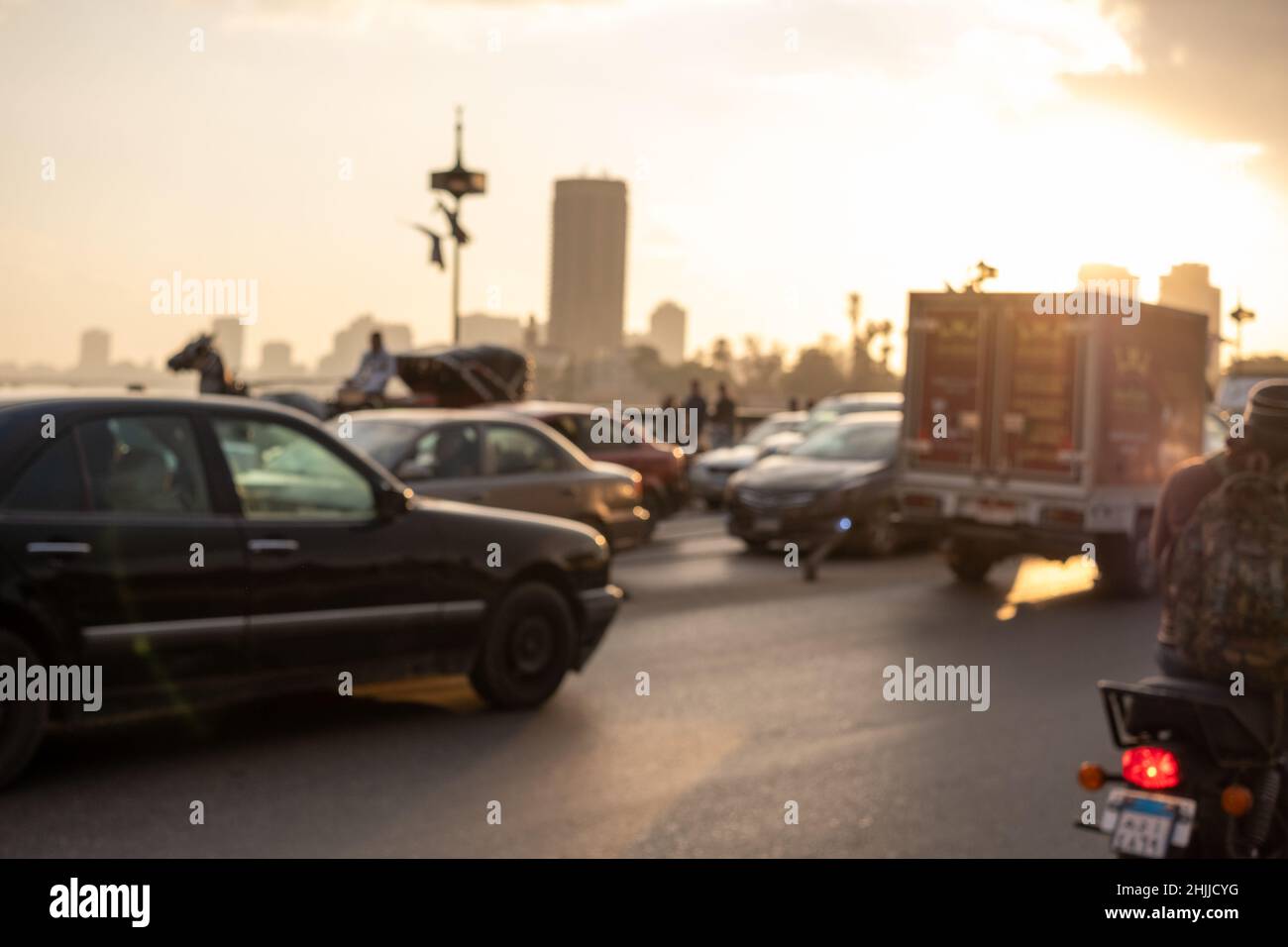 Out of focus view of a bridge in cairo at sunrise. Concepts of traffic ...