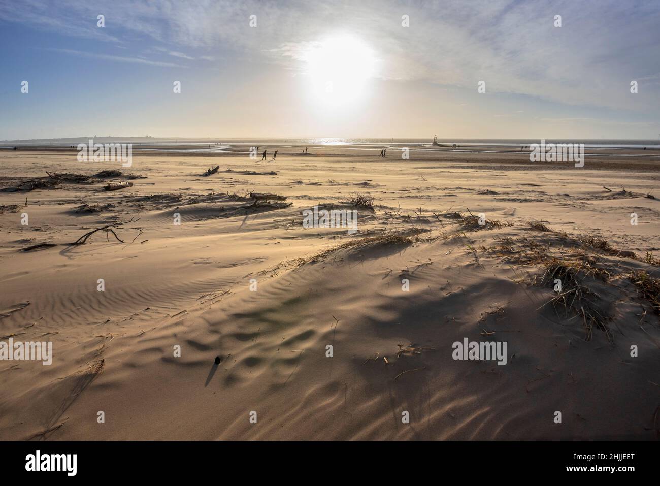 Crosby beach on the river Mersey at sunset ona winters afternoon with ...