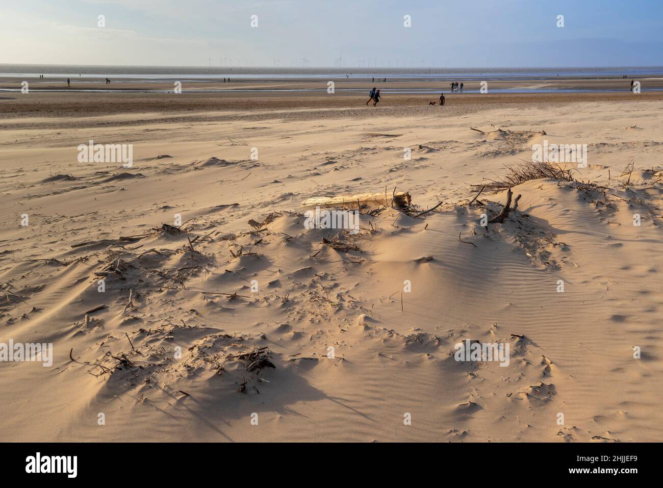 Crosby beach on the river Mersey at sunset ona winters afternoon with ...