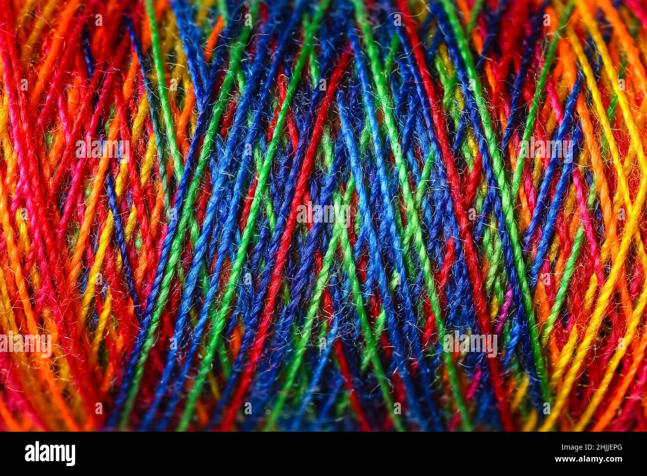Colorful sewing threads as background Stock Photo - Alamy