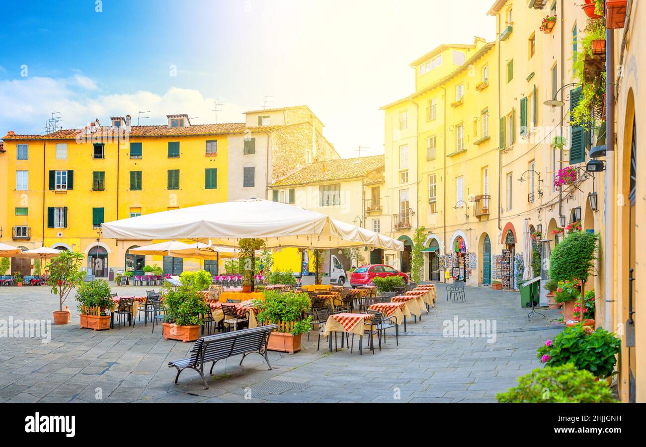 Cafe in the cozy morning lighted square of the old European city Stock ...