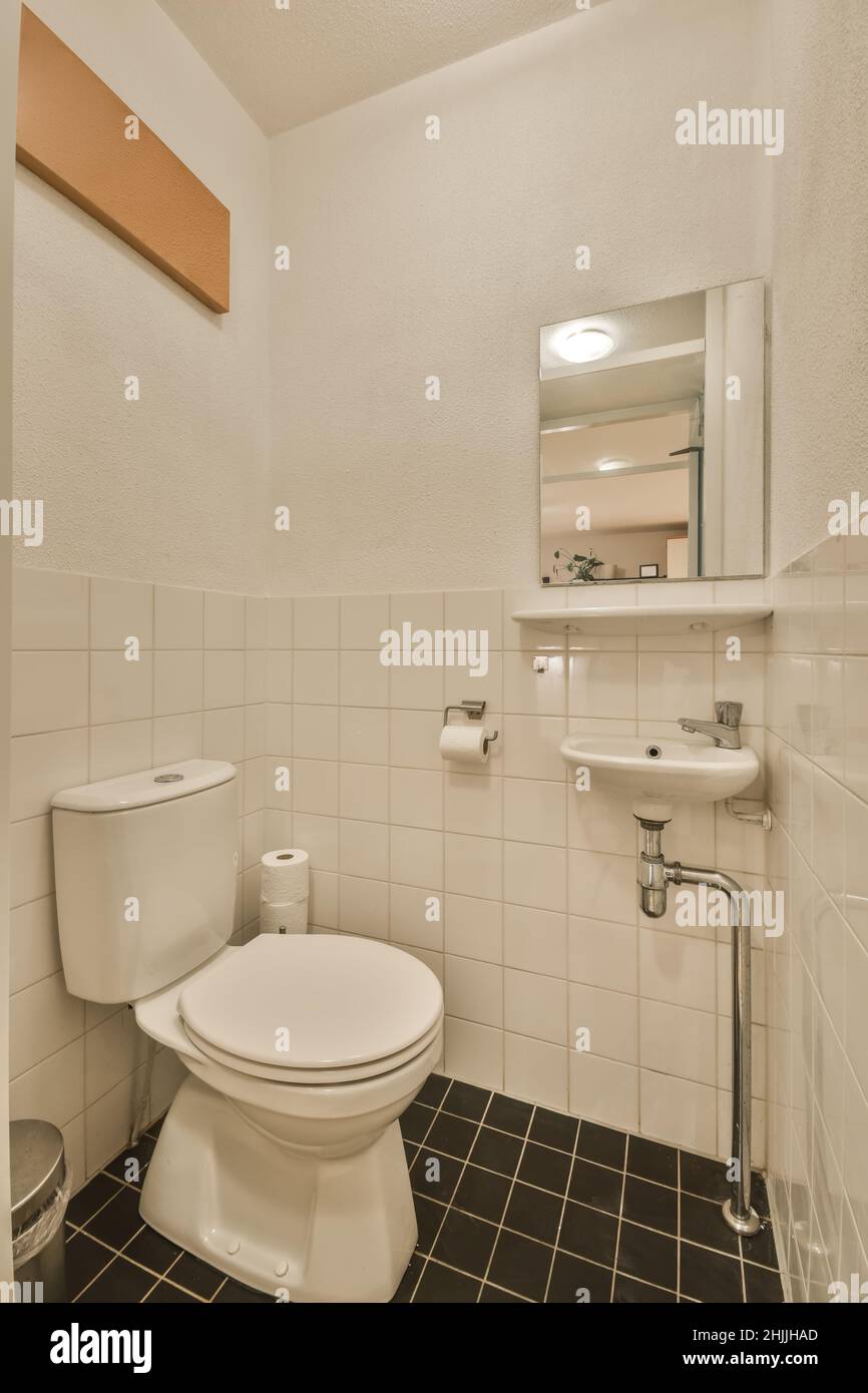 Interior of small clean restroom in miniature style Stock Photo - Alamy