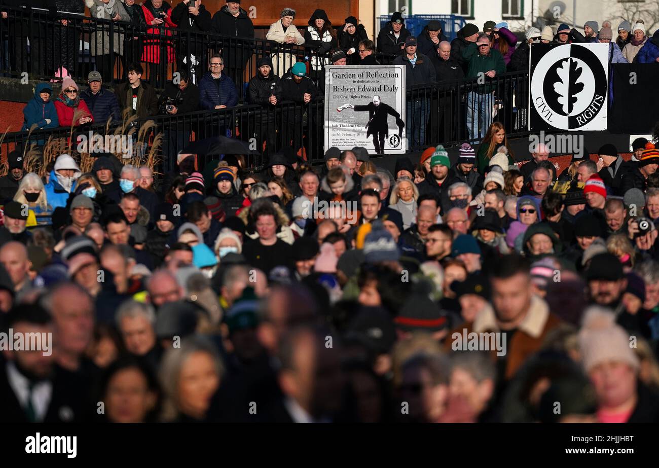 People gather at the Bloody Sunday Memorial to mark the 50th ...