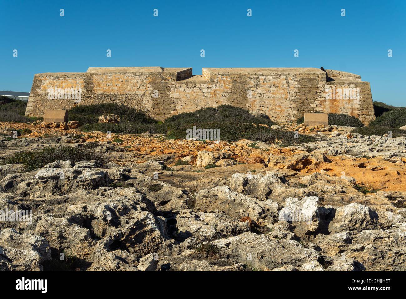 Old military building on the Mallorcan coast in the town of Cala d'Or ...