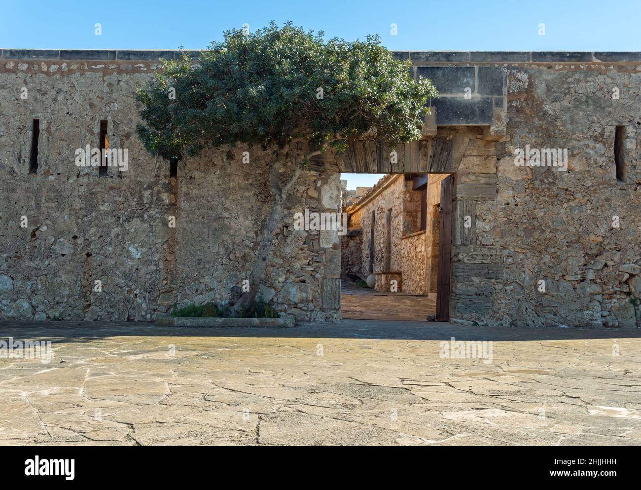 Old military building on the Mallorcan coast in the town of Cala d'Or ...