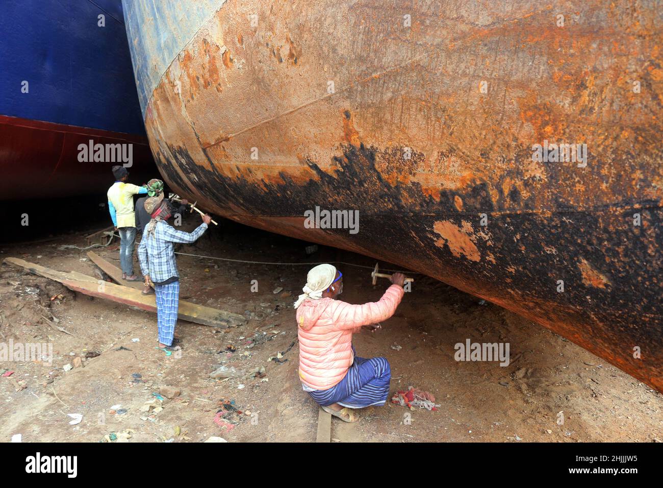 Dockyard laborers seen around the ships along the bank of the Buriganga ...