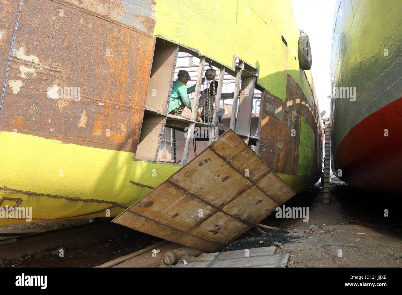 Dockyard laborers seen around the ships along the bank of the Buriganga ...