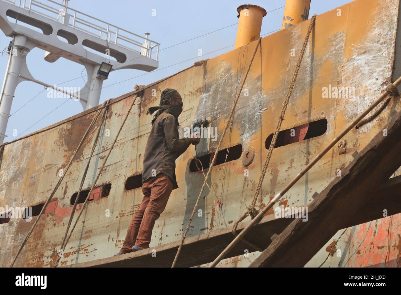 Dockyard laborers seen around the ships along the bank of the Buriganga ...