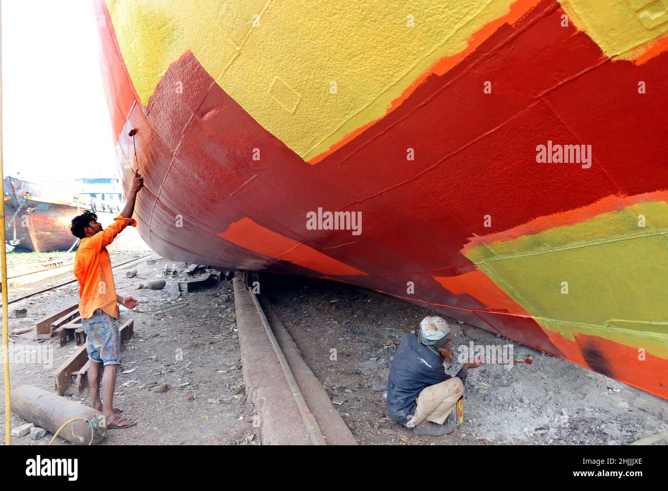 Dockyard laborers seen around the ships along the bank of the Buriganga ...