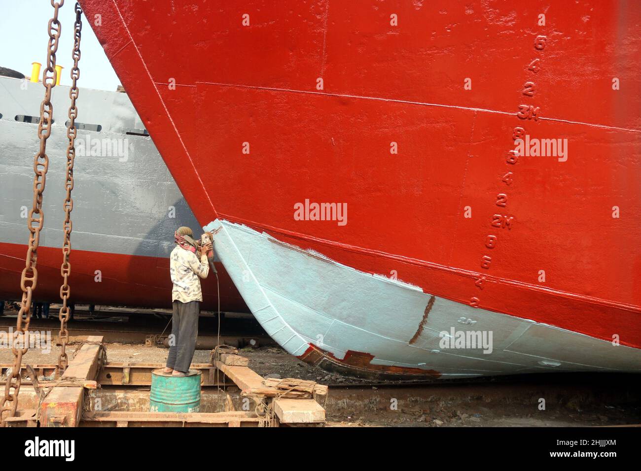 Dockyard laborers seen around the ships along the bank of the Buriganga ...