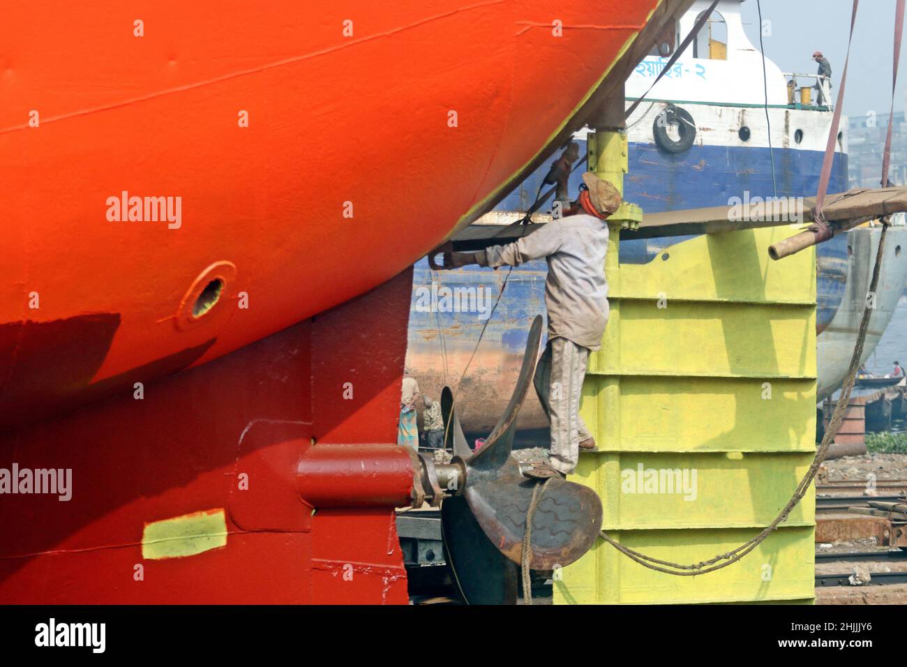 Dockyard laborers seen around the ships along the bank of the Buriganga ...