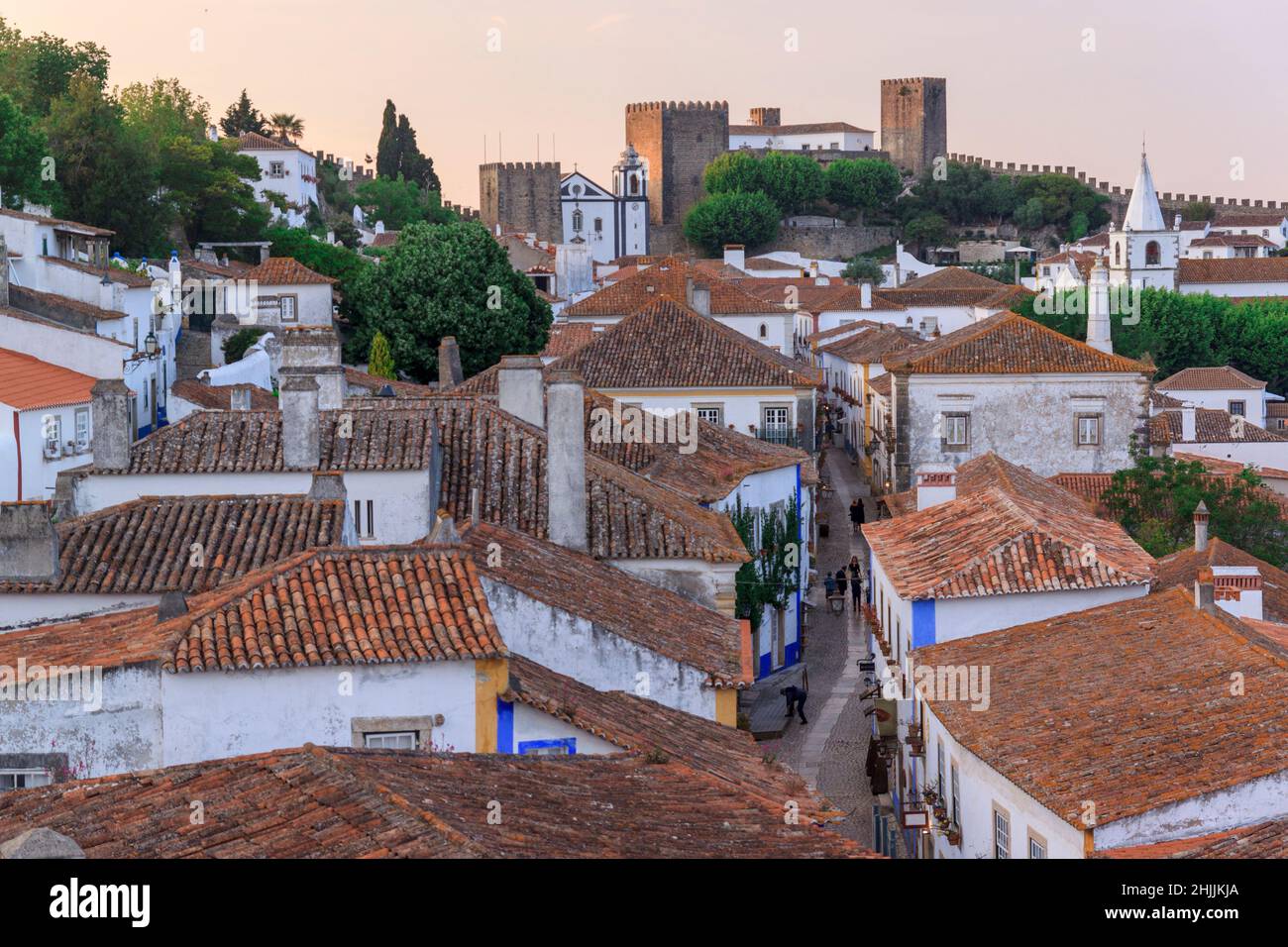 Scenic view of white houses red tiled roofs. and castle of Obidos from ...