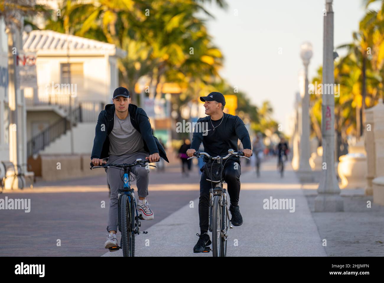 Hollywood, FL, USA - January 29, 2022: Photo of two friends talking and ...