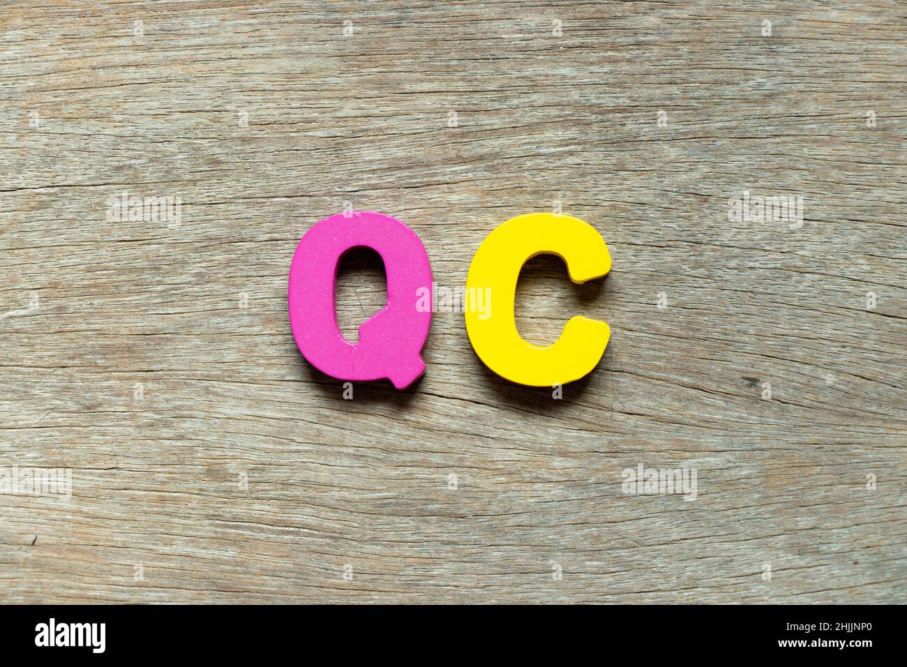 Color alphabet letter in word QC (Abbreviation of Quality Control) on ...