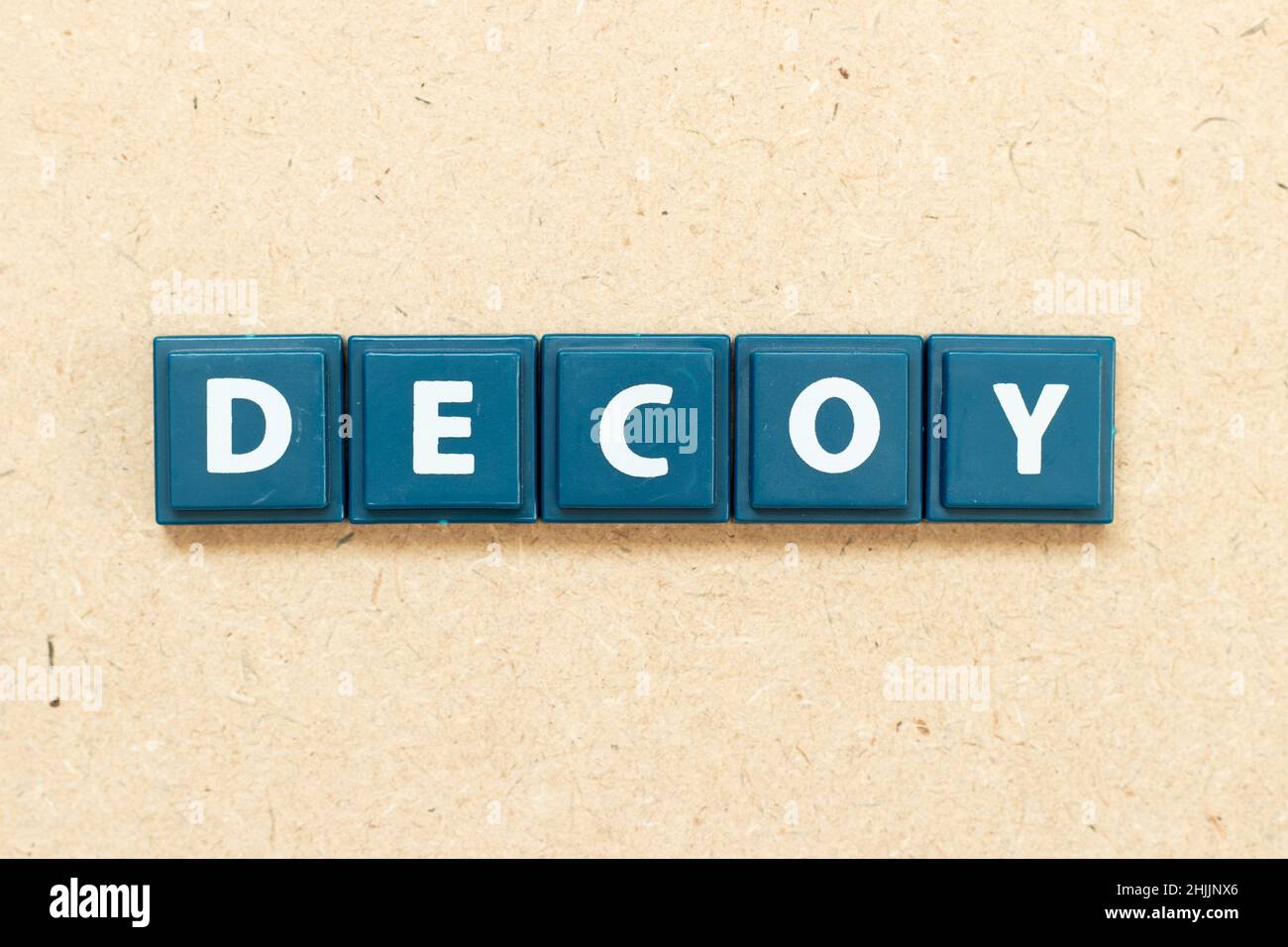 Tile alphabet letter in word decoy on wood background Stock Photo - Alamy