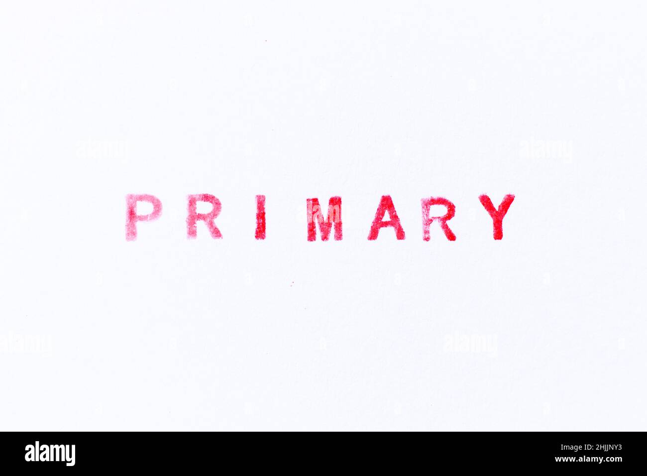 Red color ink rubber stamp in word primary on white paper background ...