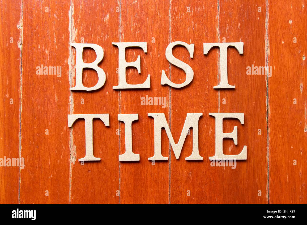 Alphabet letter in word best time on old red color wood plate ...