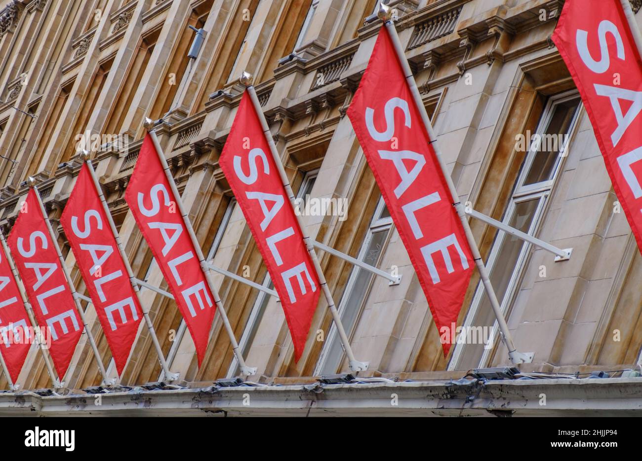 Multiple Large Signs Advertising A Major Sale At An Urban Department ...