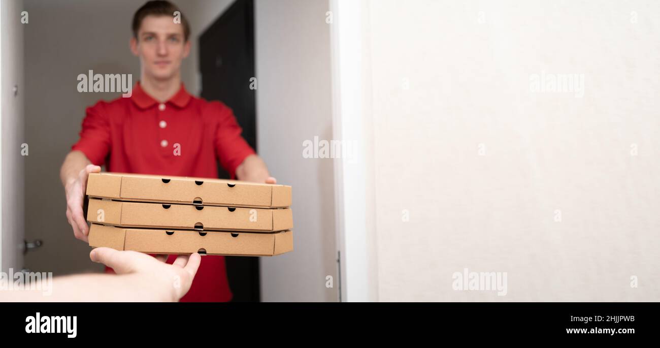 Pizza delivery home, courier man gives boxes to customer, italian ...
