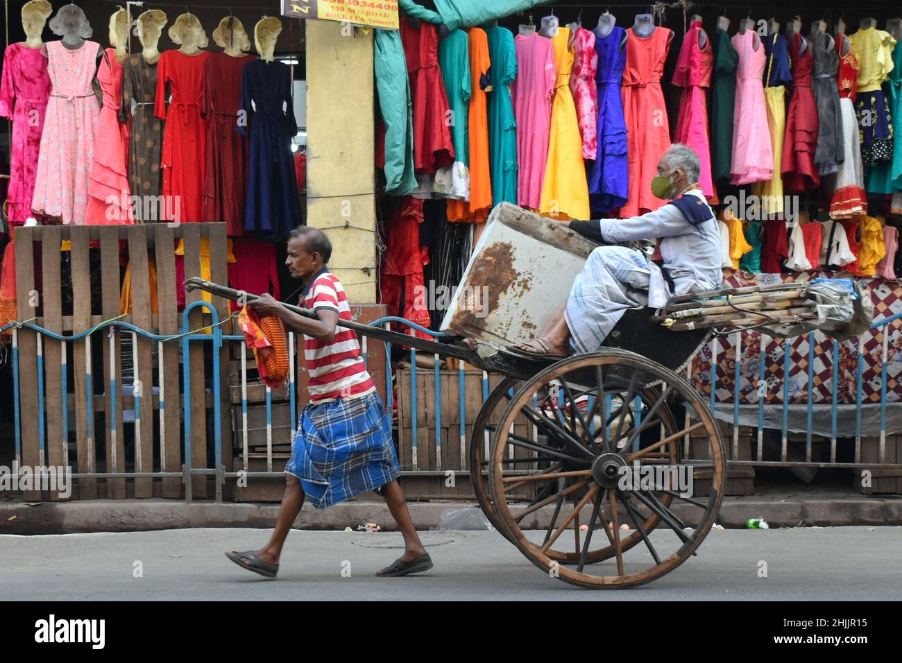 Kolkata, West Bengal, India. 30th Jan, 2022. A person travels on a hand ...