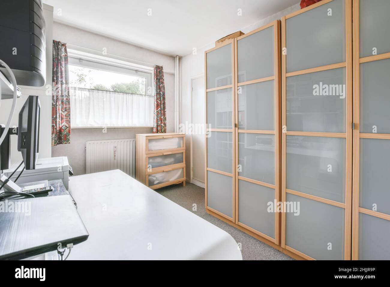 Comfortable work room with large windows on the wall Stock Photo - Alamy