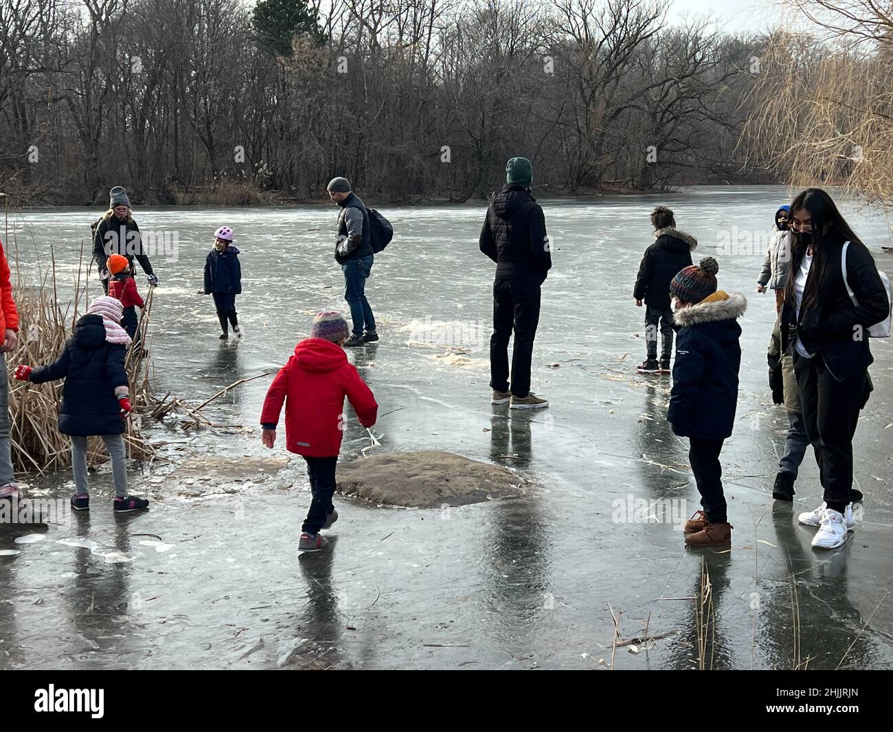 Adults and kids alike can't resist walking on the frozen lake in ...