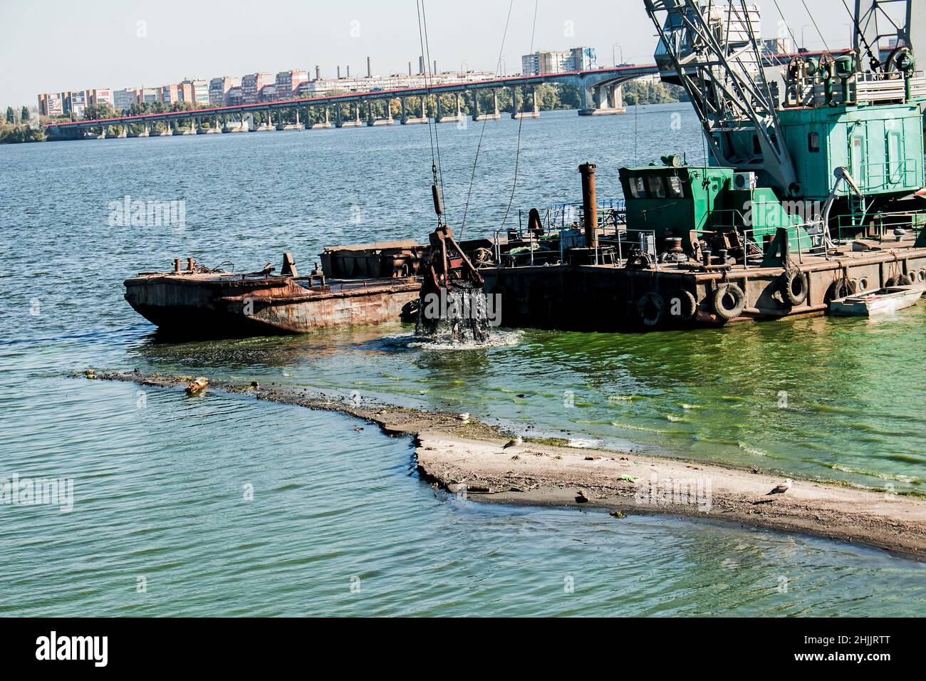 Cleaning the newly formed island from industrial waste on the Dnieper ...