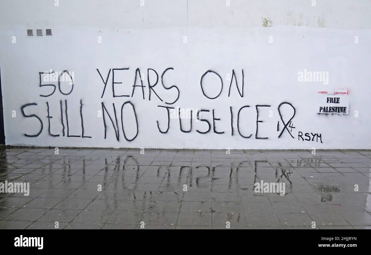 Graffiti on a wall ahead of a march to mark the 50th anniversary of ...