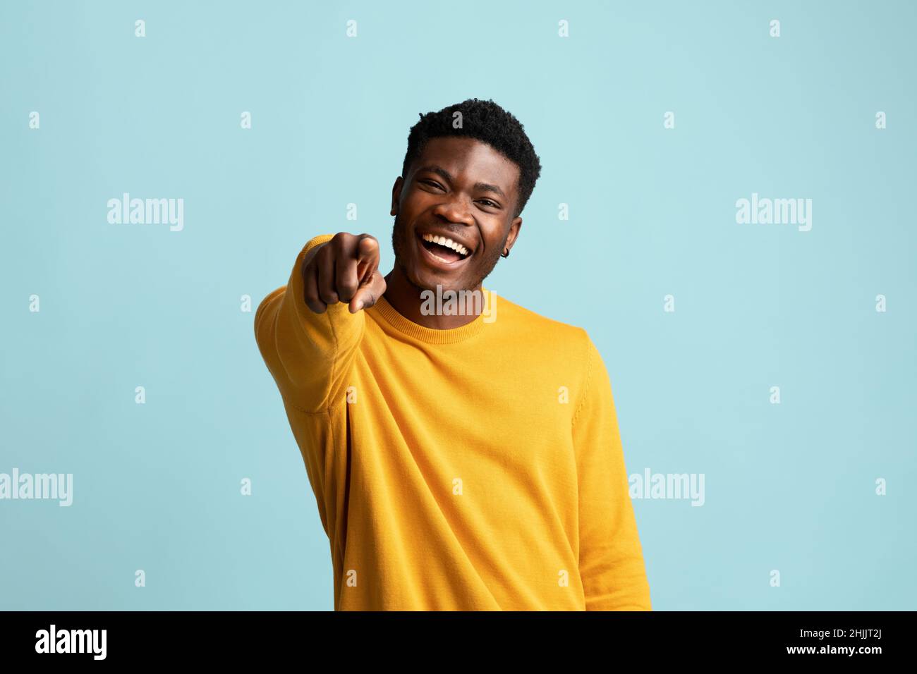 Happy african guy gesturing hi-res stock photography and images - Alamy