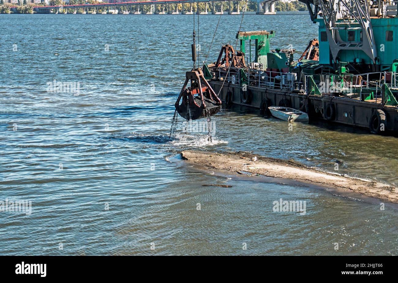 Cleaning the newly formed island from industrial waste on the Dnieper ...