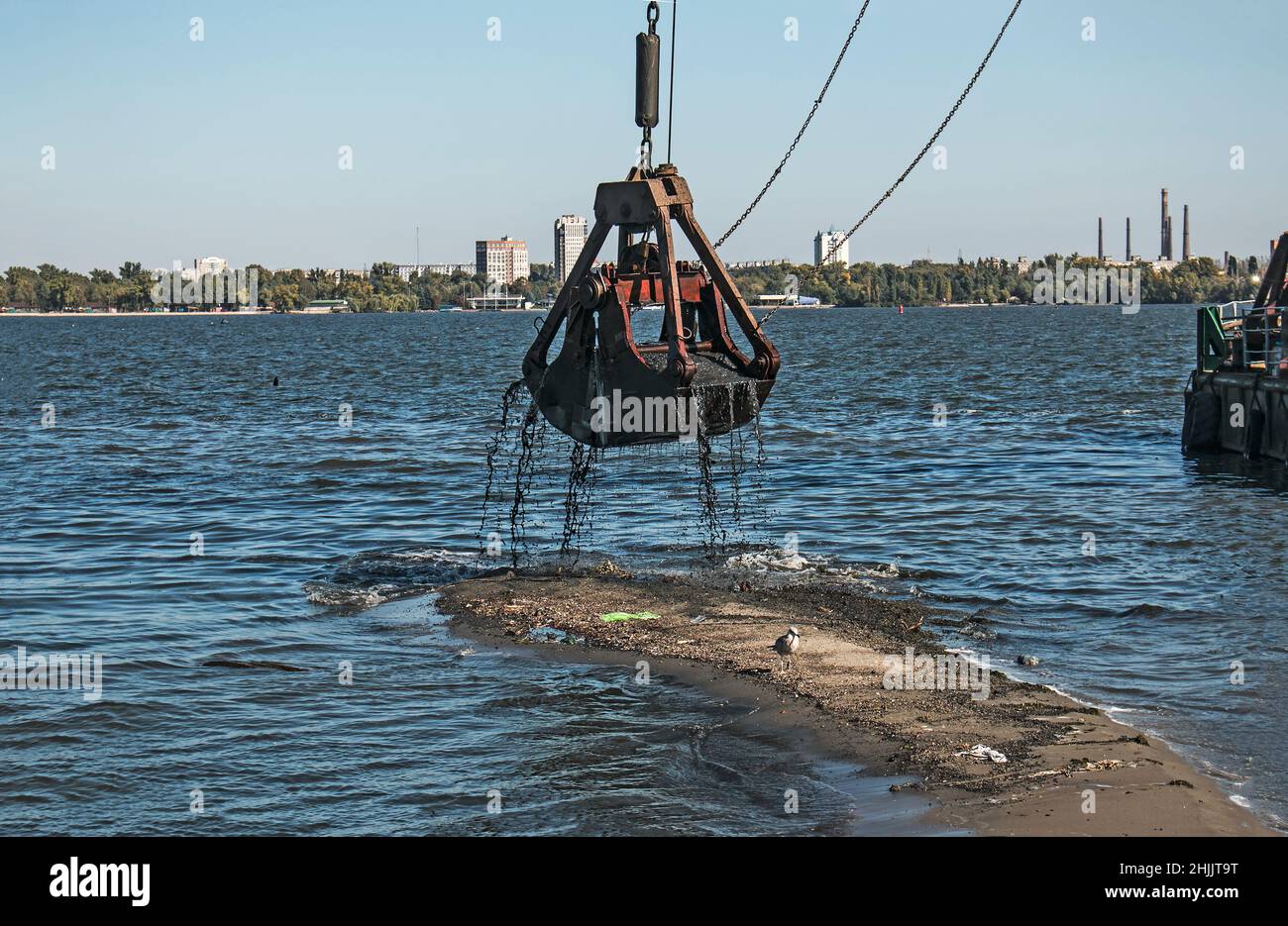 Cleaning the newly formed island from industrial waste on the Dnieper ...