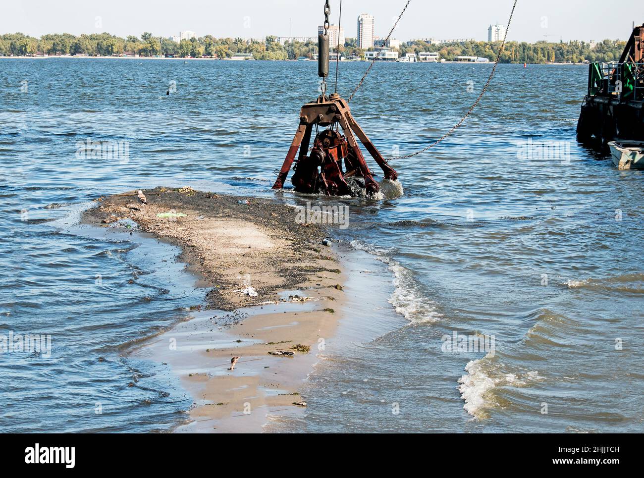 Cleaning the newly formed island from industrial waste on the Dnieper ...