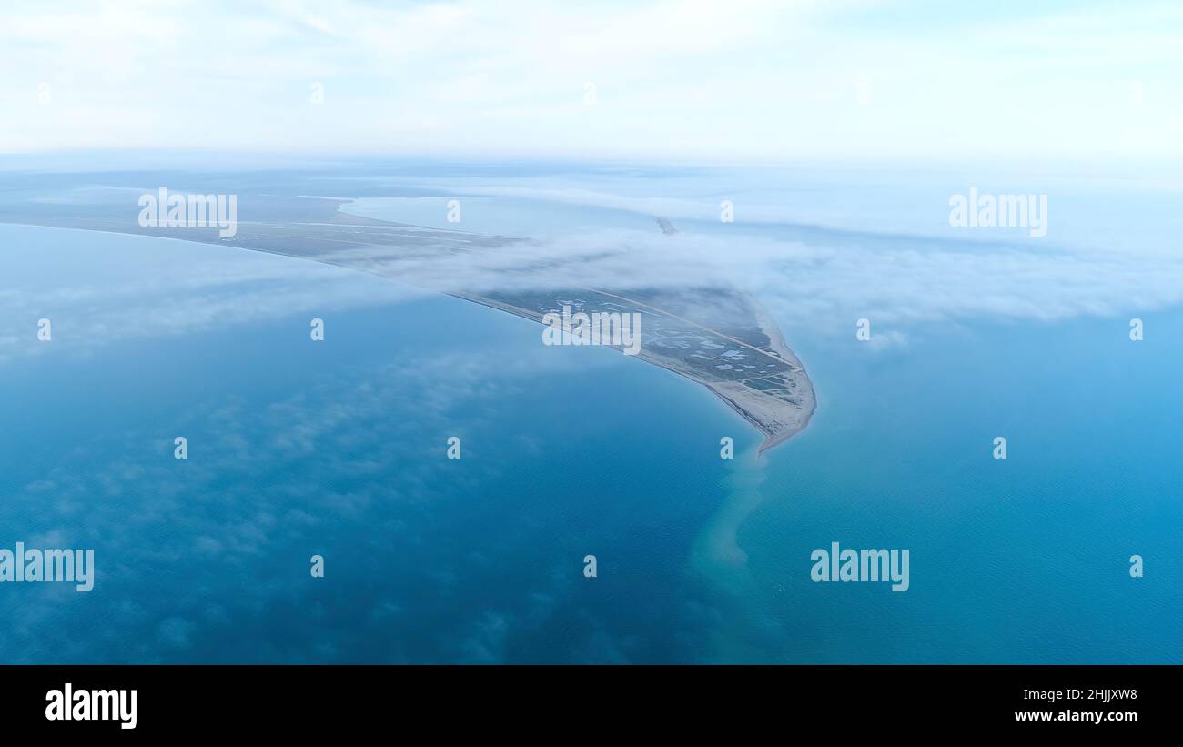 Top view of coast among sea on background of sky horizon. Shot. The ...