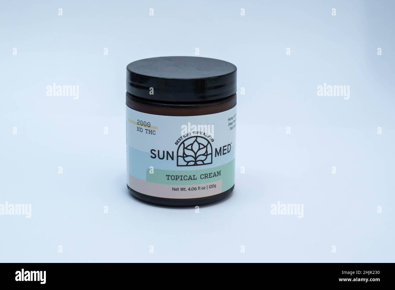 Jar of Sun Med tropical Cream on a white background Stock Photo - Alamy