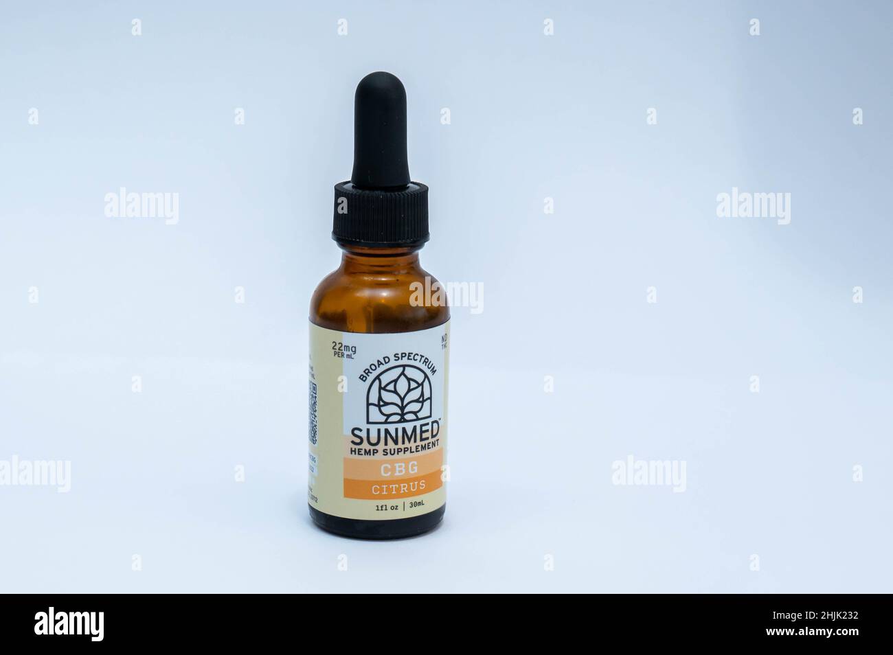 Bottle of Sunmed CBG citrus med for the relief of pain on a white ...