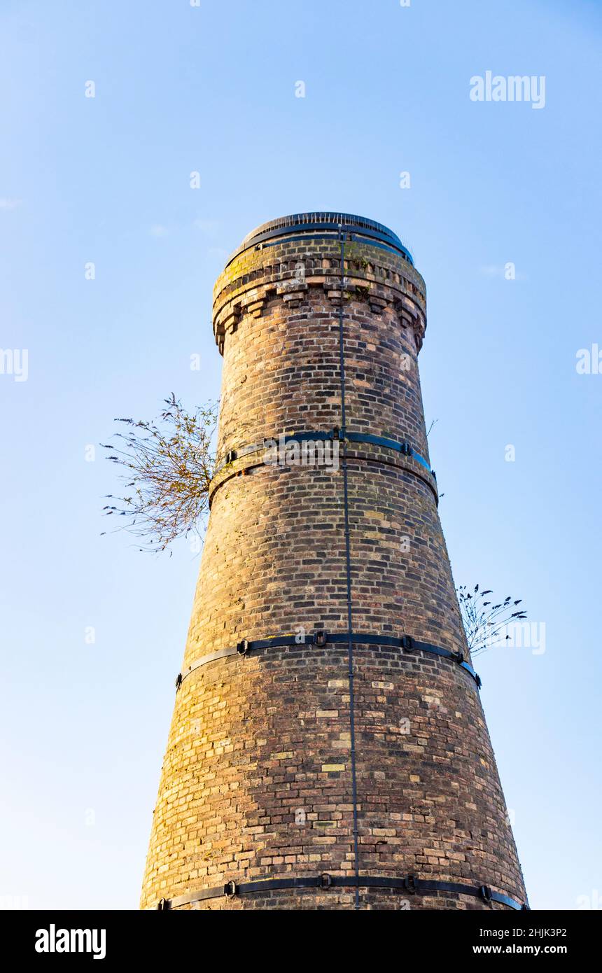top of traditional victorian ceramic pottery factory chimney against ...
