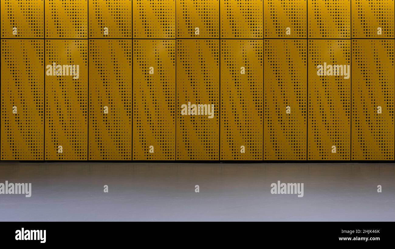 Perforated metal wall background, front view. Yellow metal background ...