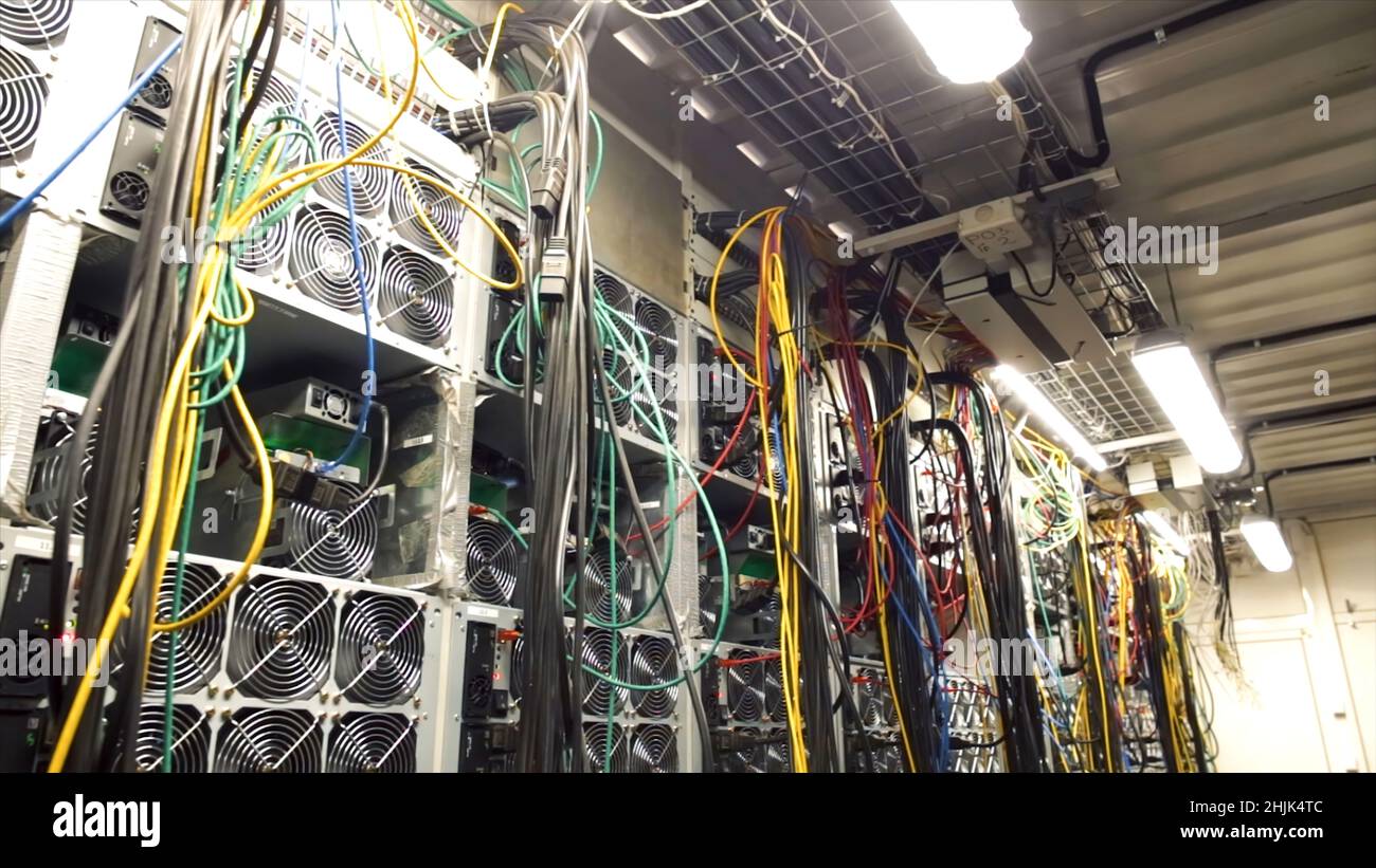 Wall of data centers and wires. Stock footage. Lots of units with data ...