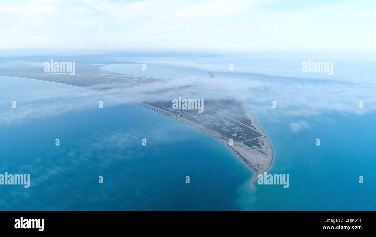 Top view of coast among sea on background of sky horizon. Shot. The ...