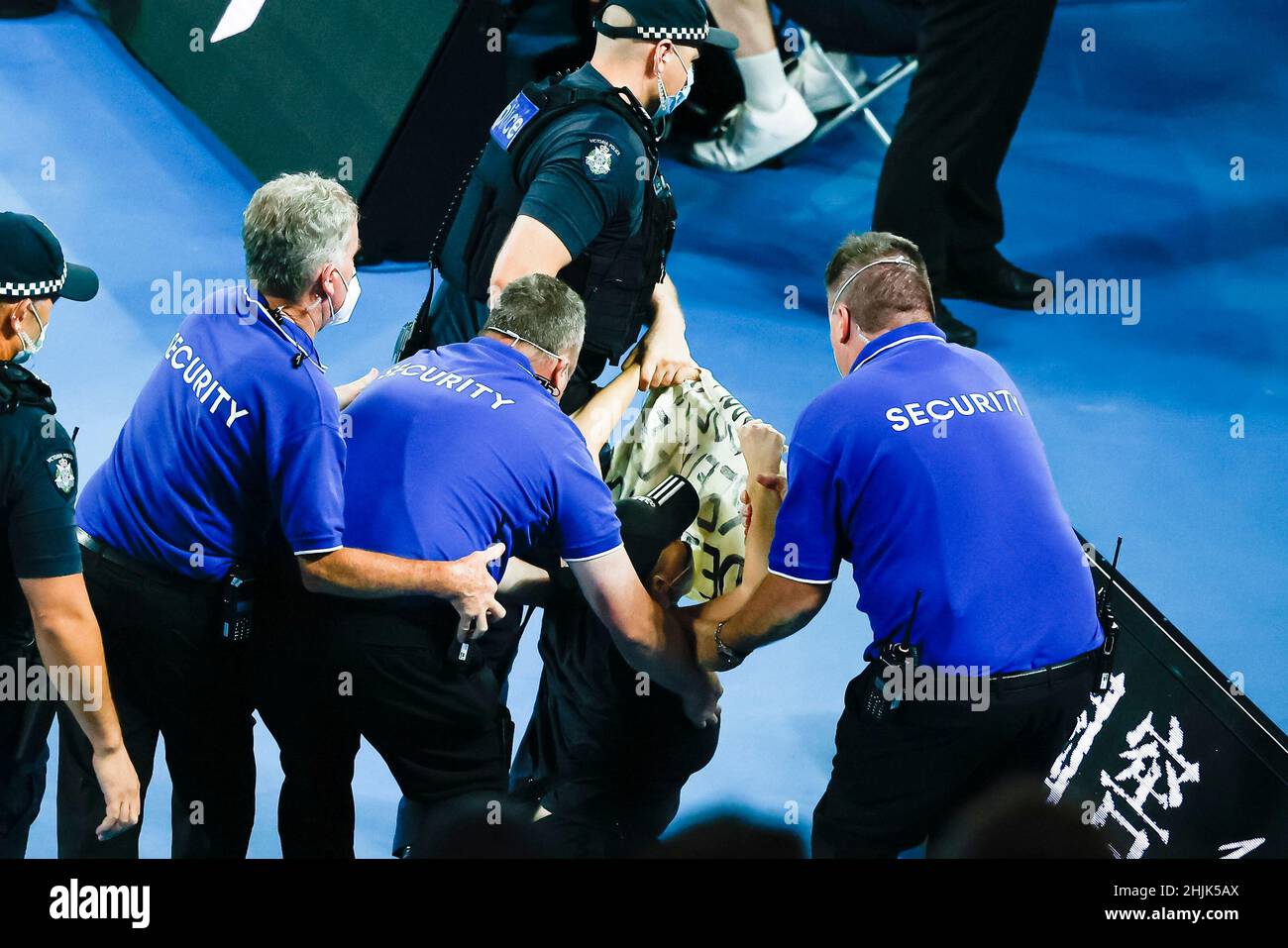 Melbourne, Australia, 30th Jan, 2022. Security forces carry an activist ...
