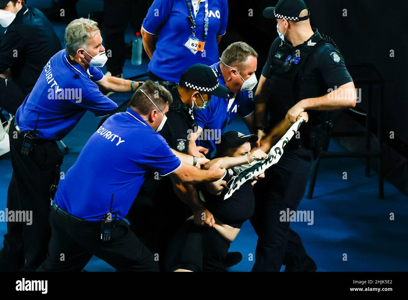 Melbourne, Australia, 30th Jan, 2022. Security forces carry an activist ...