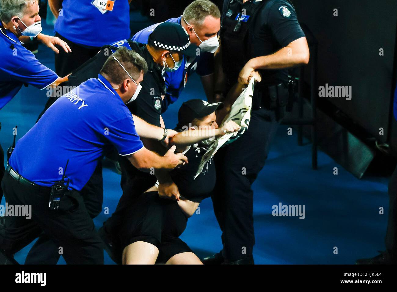 Melbourne, Australia, 30th Jan, 2022. Security forces carry an activist ...