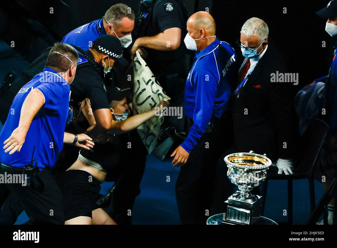 Melbourne, Australia, 30th Jan, 2022. Security forces carry an activist ...