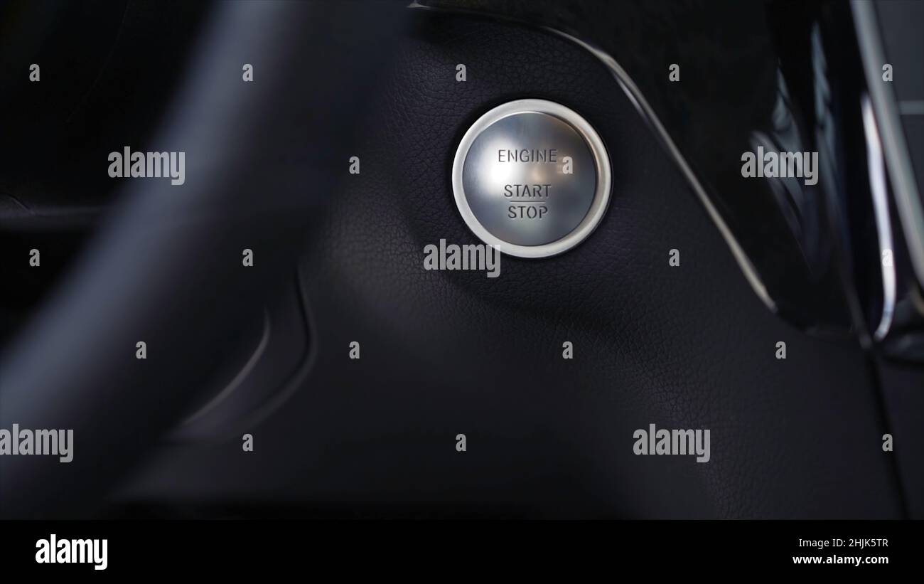 Driver hand pushes engine start stop button. Stock. Modern luxury ... Driver hand pushes engine start stop button. Stock. Modern luxury ...
