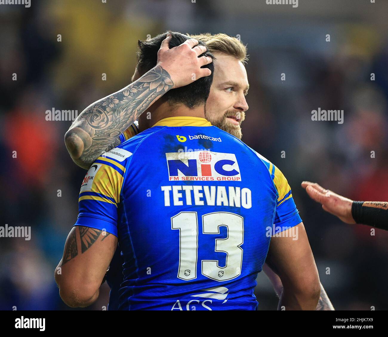 Blake Austin of Leeds Rhinos celebrates his try with Zane Tetevano of ...