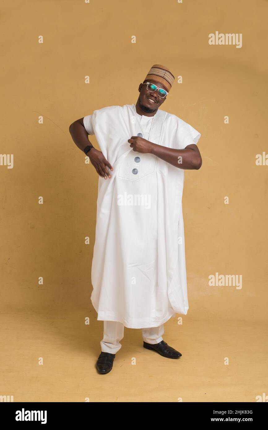 A Traditionally Dressed Northern Business Man Adjusting His Dress Stock ...