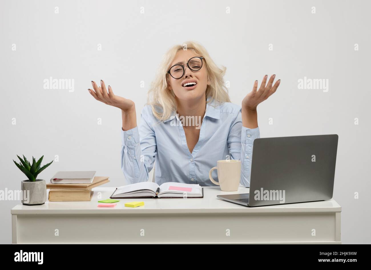 Overworked frustrated businesswoman doing boring work, sitting at ...